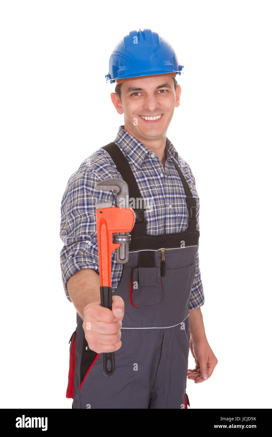 Happy Male Worker Holding Worktool Over White Background Stock Photo ...