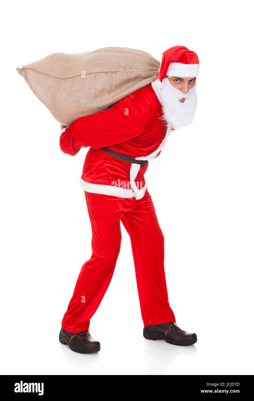 Santa Carrying Sack On Shoulder On White Background Stock Photo - Alamy