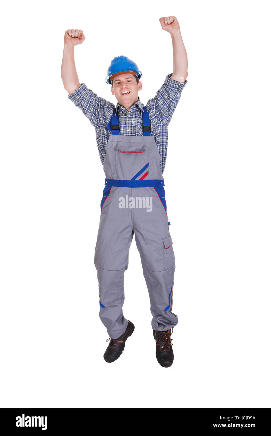 Portrait of Excited Male Technician raising hands Isolated Over White ...