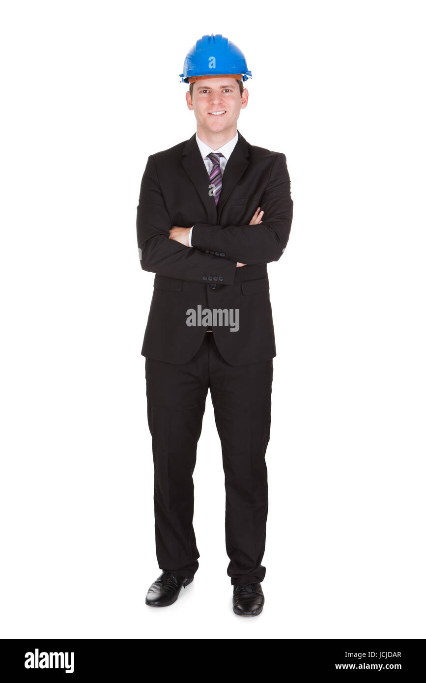 Portrait of successful male architect standing on white background ...