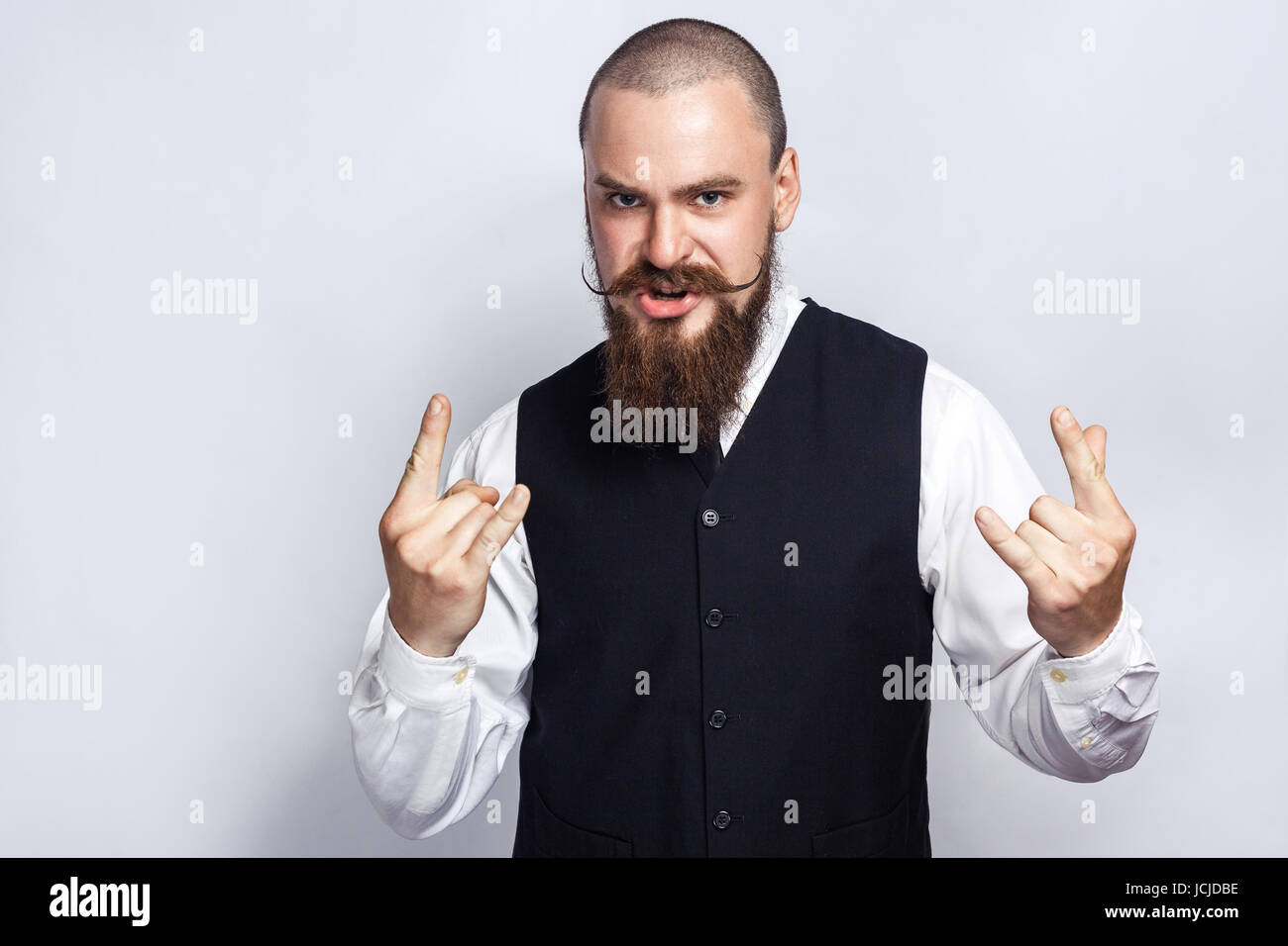 Rock. Handsome businessman with beard and handlebar mustache looking at ...