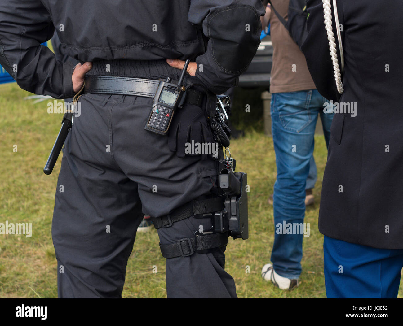 member of arrest unit from behind Stock Photo - Alamy