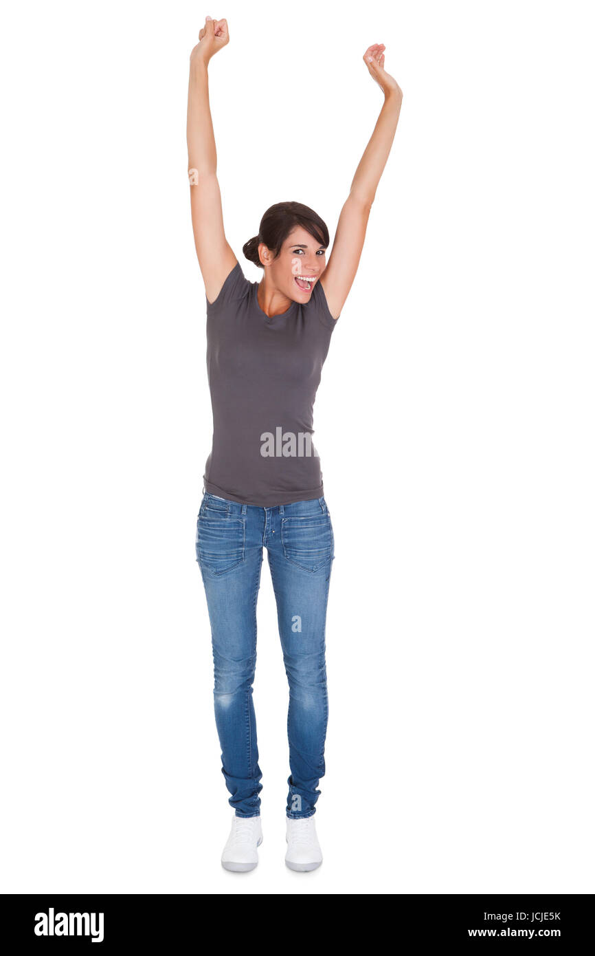 Beautiful Woman In Casual Wear Raising Arm Over White Background Stock ...