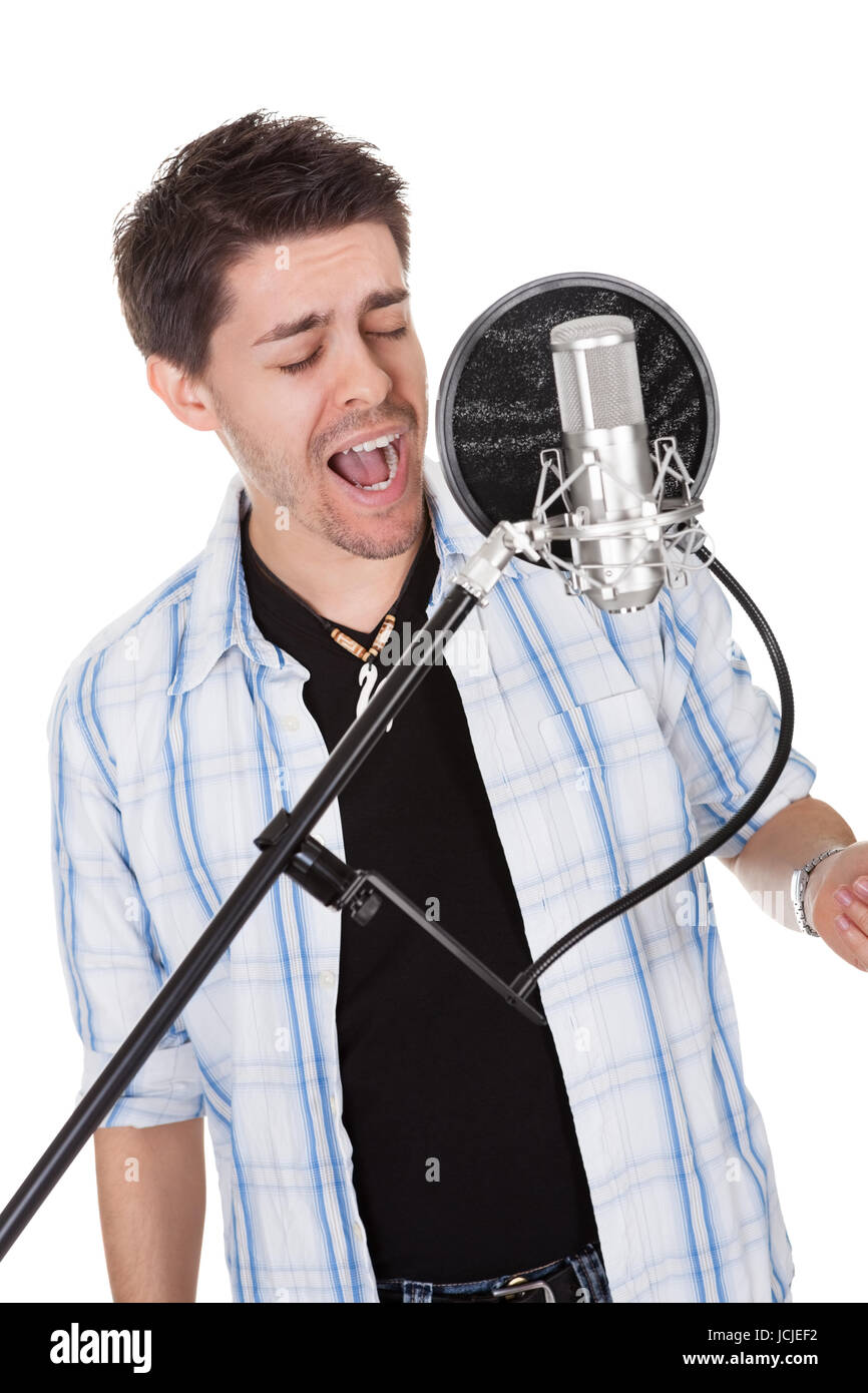 Young singer and microphone. Isolated on white Stock Photo - Alamy