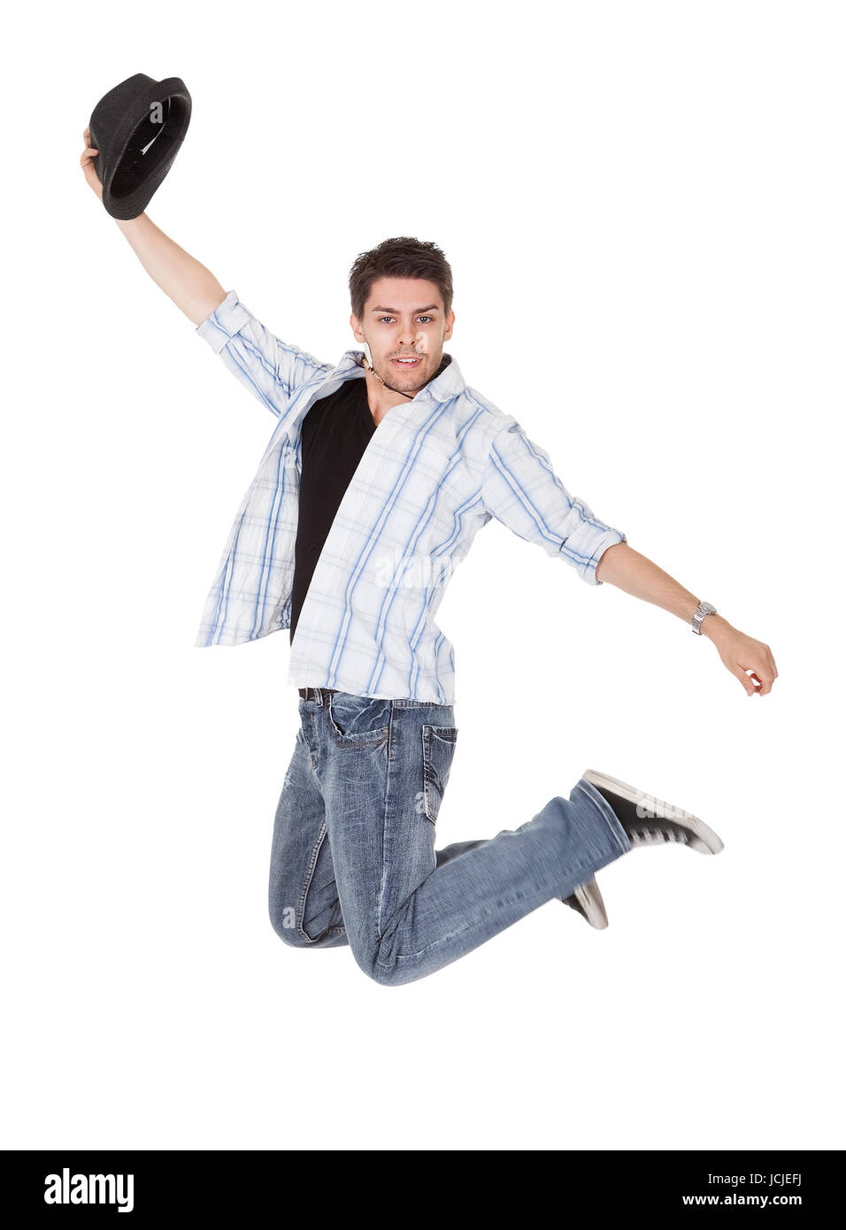 Young dancer in mid air jump with arms outstretched Stock Photo - Alamy
