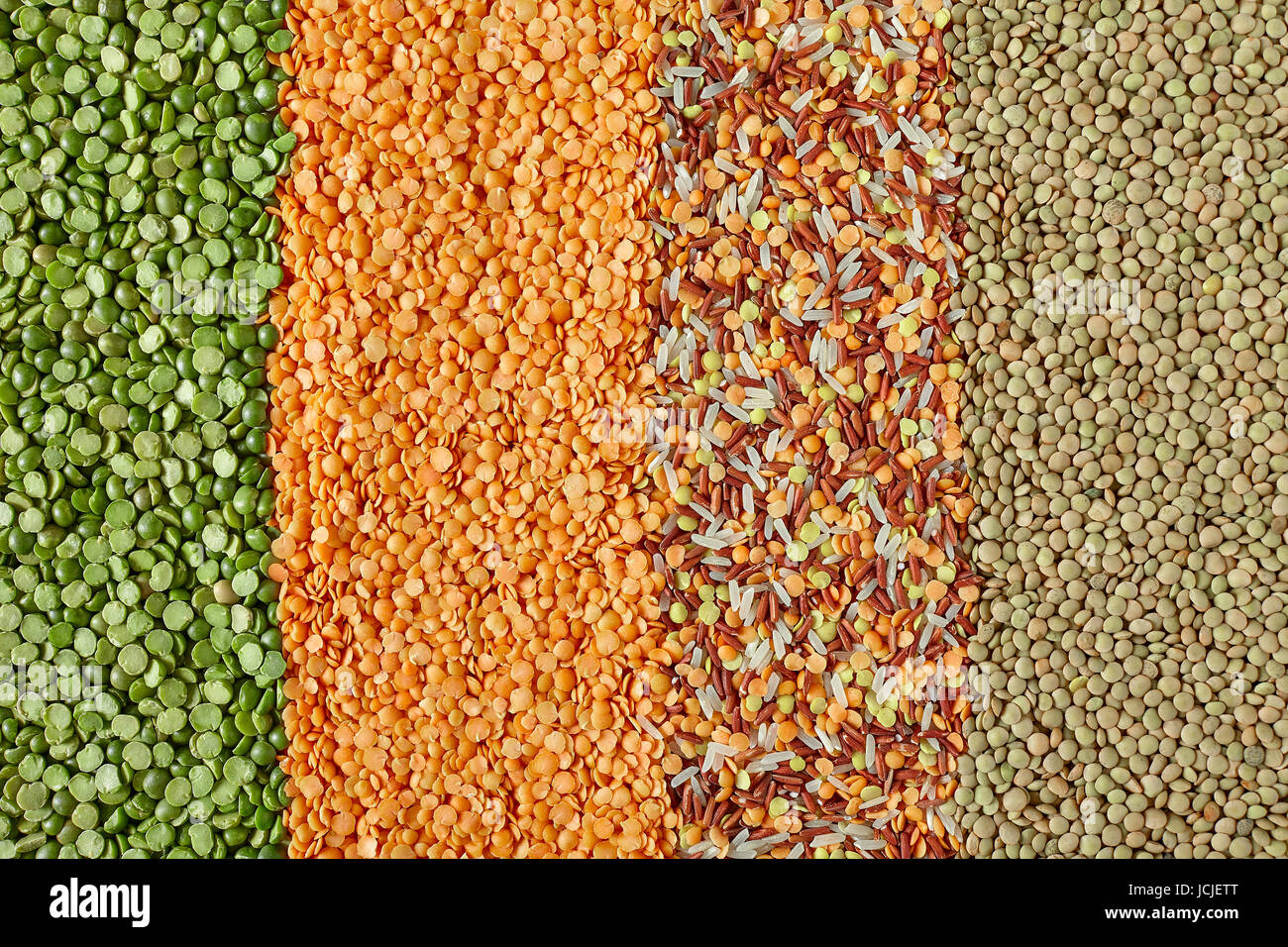 Dried legumes in vertical layers, from left to right: green split peas ...