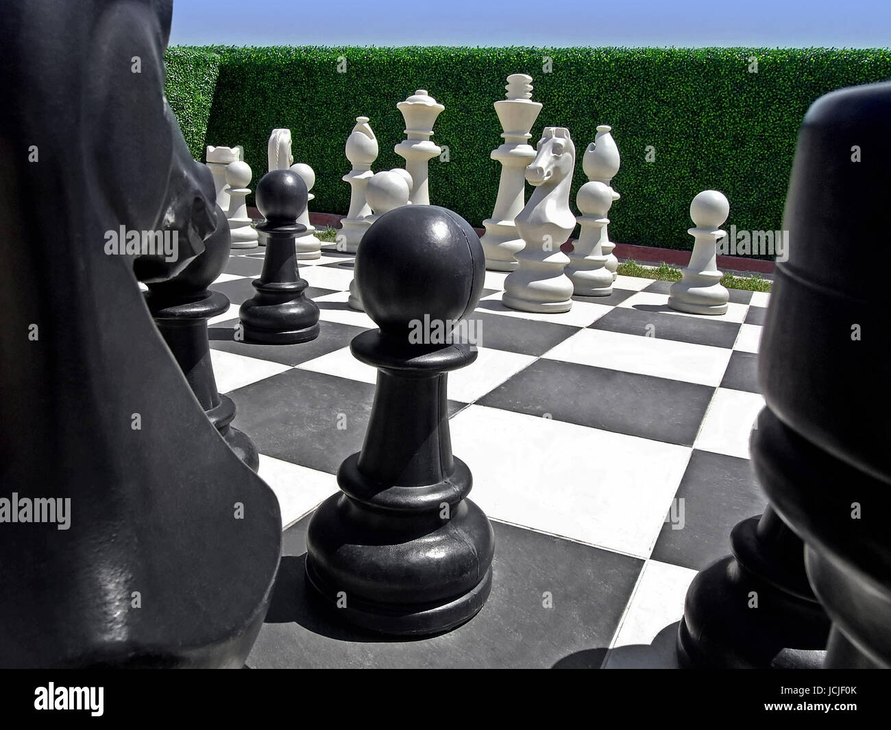 Outdoor chess board in garden with pieces Stock Photo - Alamy