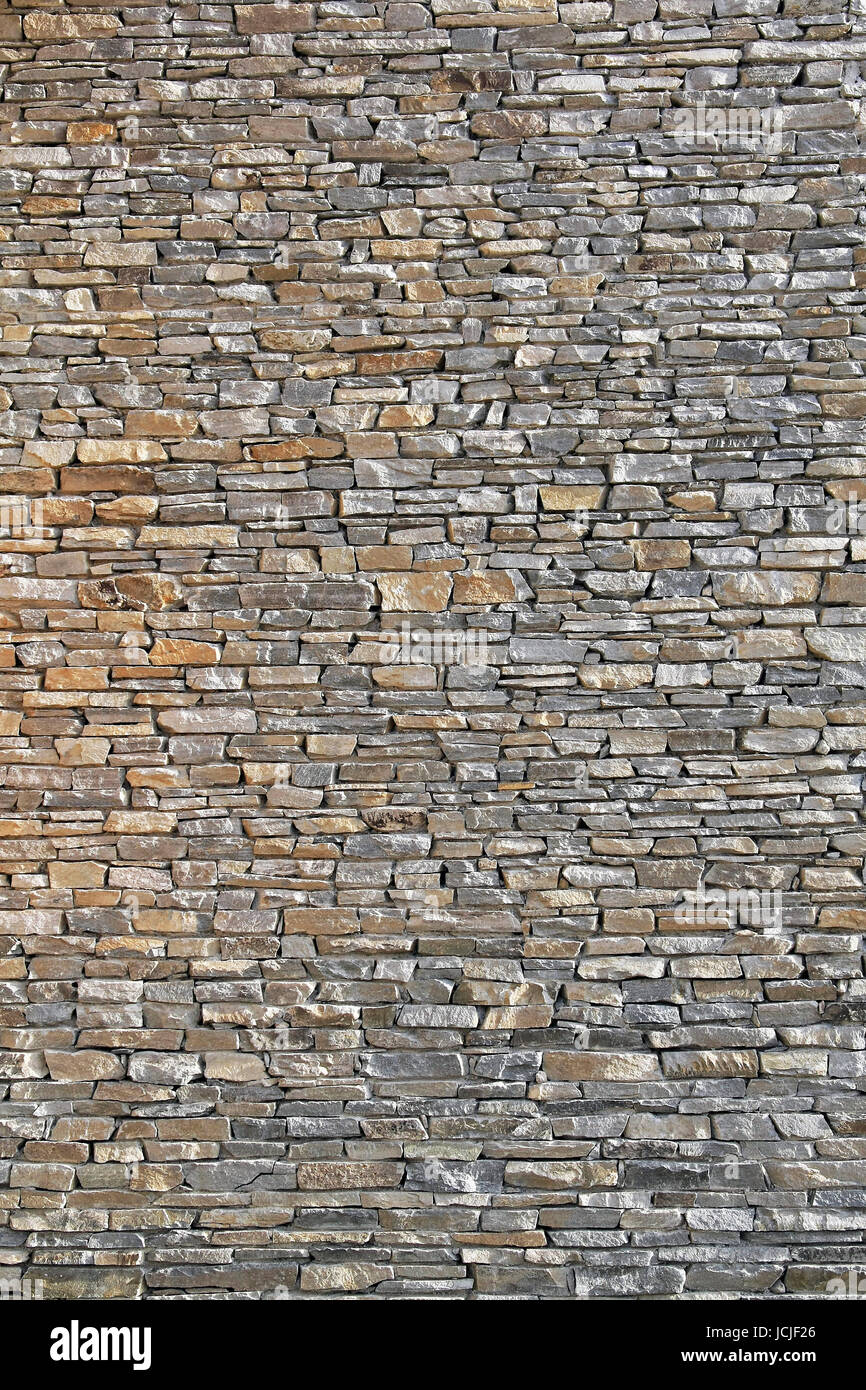 Big wall made from grey stone bricks Stock Photo - Alamy