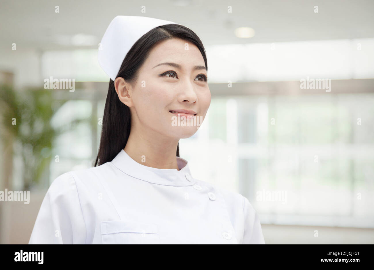 Looking away uniform authority smiling hi-res stock photography and ...