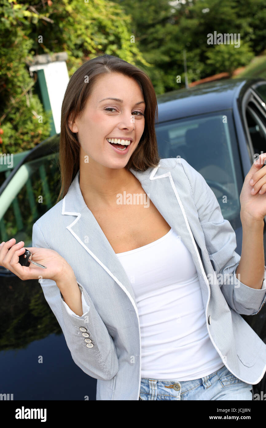 Happy young driver standing by car Stock Photo - Alamy