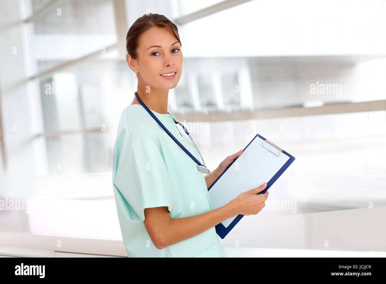 Portrait of beautiful nurse standing in hospital Stock Photo - Alamy