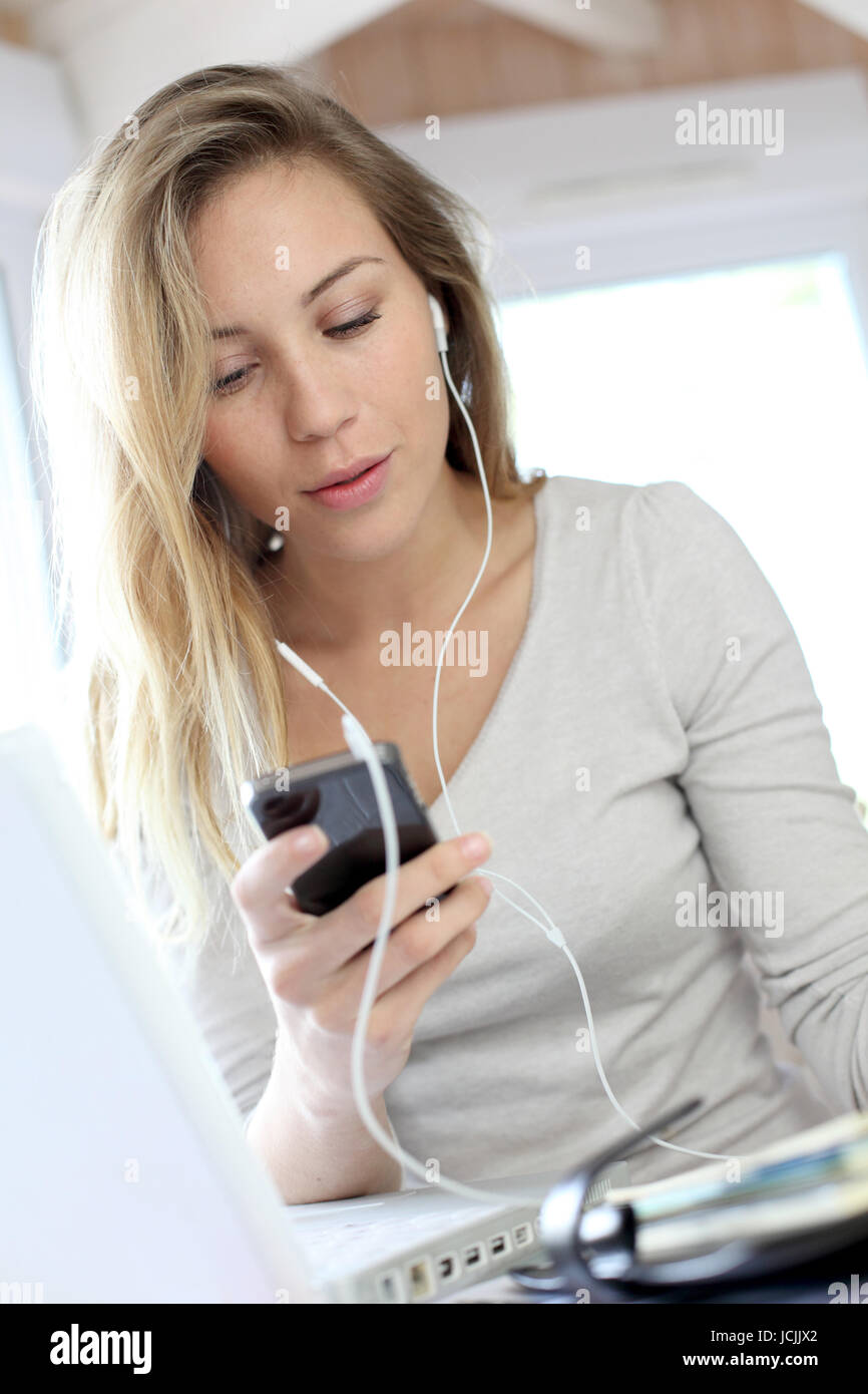Woman working at home with mobile phone Stock Photo - Alamy