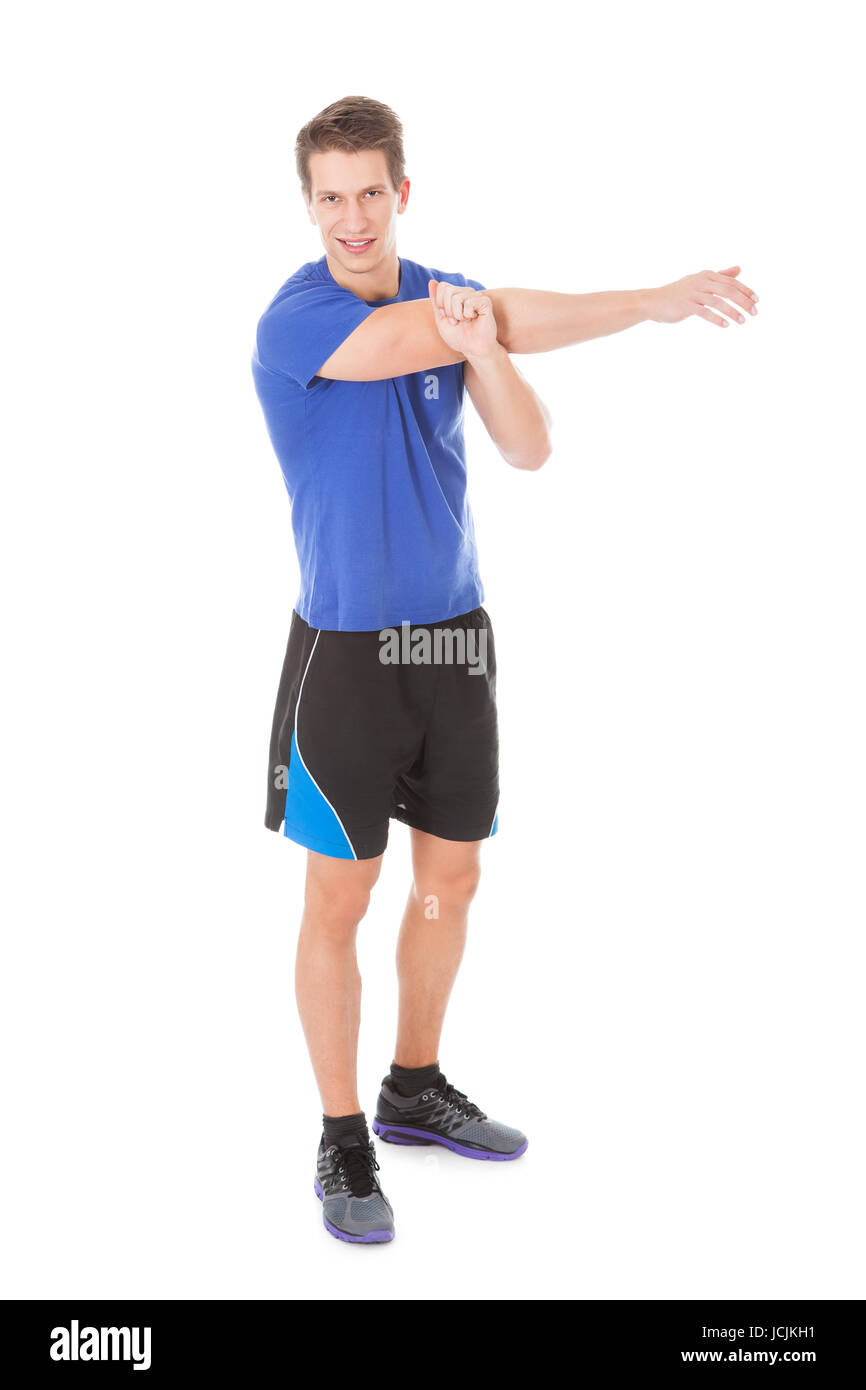 Portrait Of Young Man Stretching His Hands Over White Background Stock ...