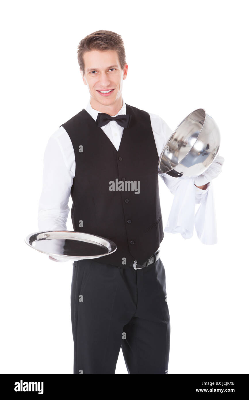 Happy Male Waiter Opening Cloche Lid Cover Over White Background Stock ... Happy Male Waiter Opening Cloche Lid Cover Over White Background Stock ...
