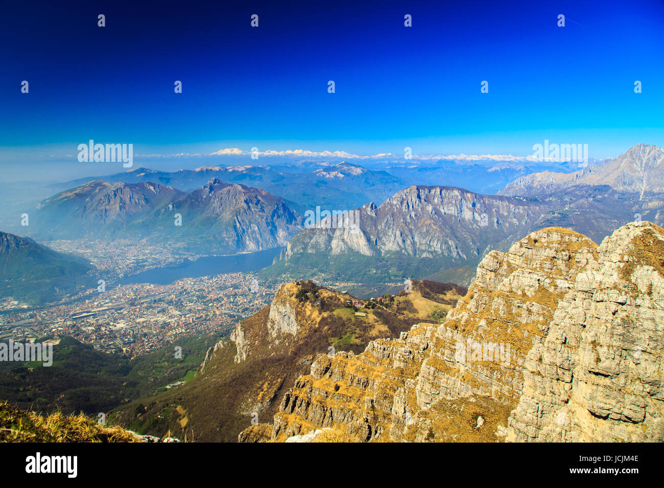 The lake of Como with the city of Lecco and the mountains behind in a ...
