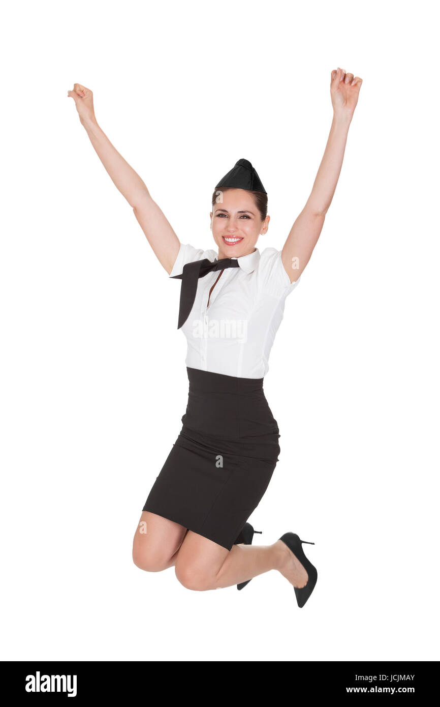 Excited young woman jumping. Isolated on white Stock Photo - Alamy
