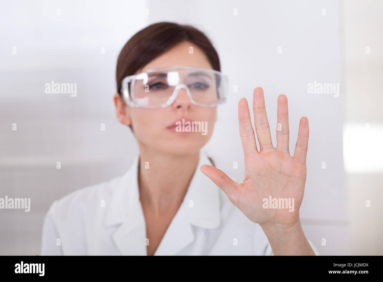 Portrait Of Female Scientist Touching The Screen With Her Finger Stock ...