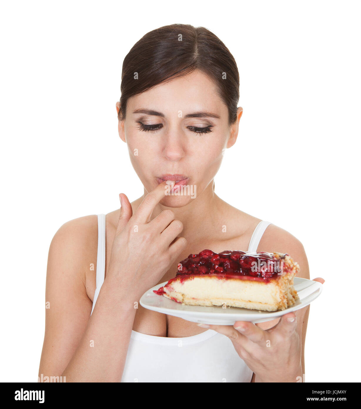 Portrait Of Young Woman Tasting Cake On White Background Stock Photo ...