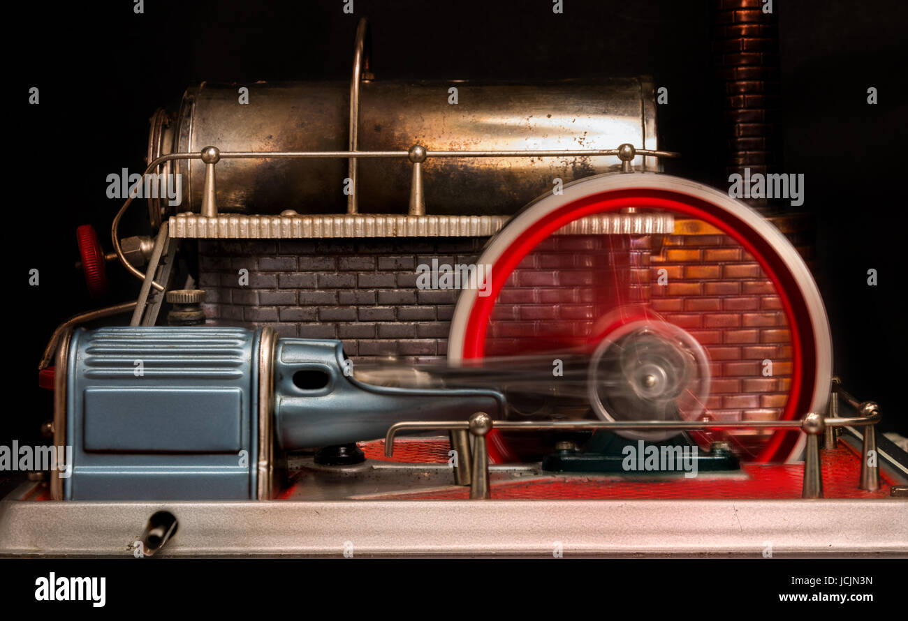 View of a moving flywheel of a steam engine Stock Photo - Alamy