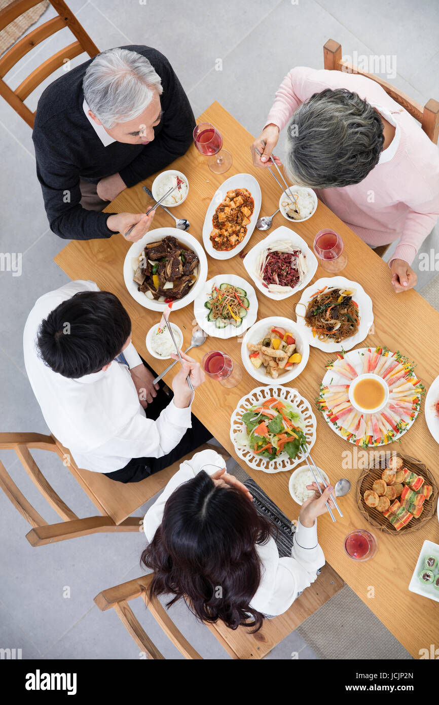 Harmonious family having meals hi-res stock photography and images - Alamy
