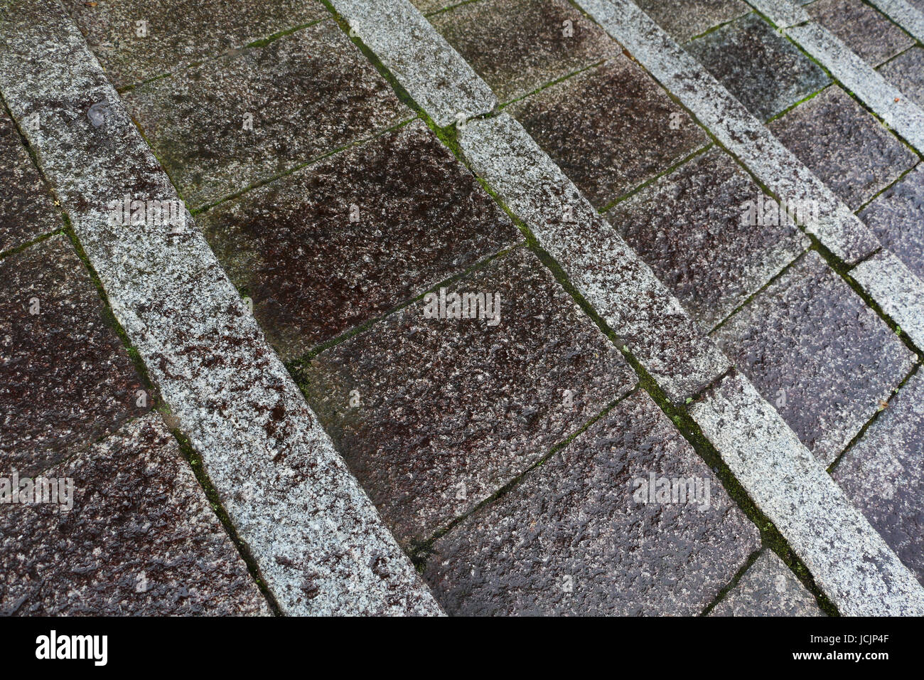 Interestiing stone pattern on old pathway in Japan in the rain, formed ...