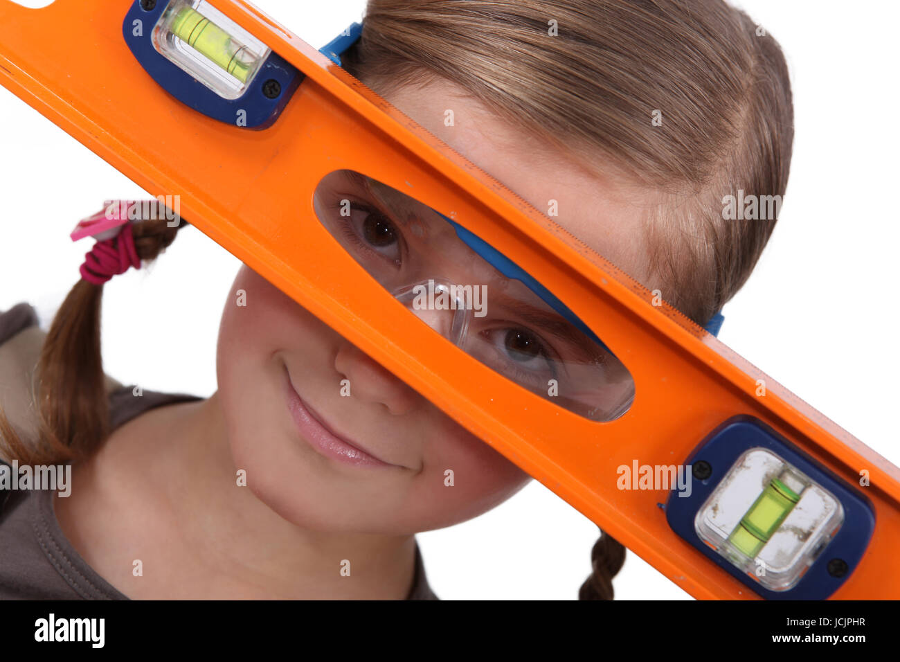 Girl with a spirit level Stock Photo - Alamy