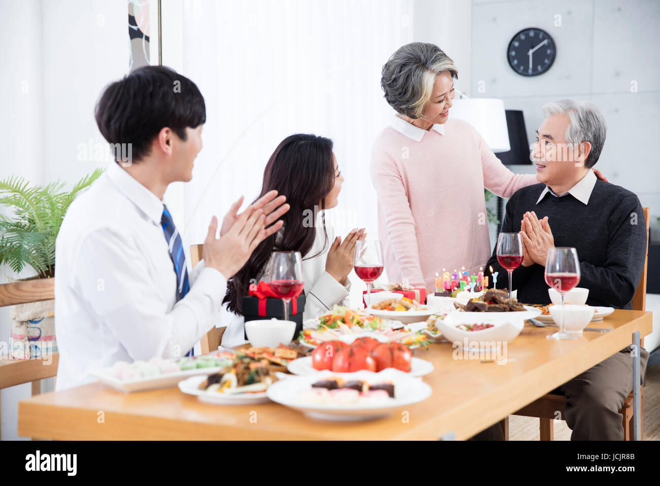 Asian family celebrating with mother hi-res stock photography and ...
