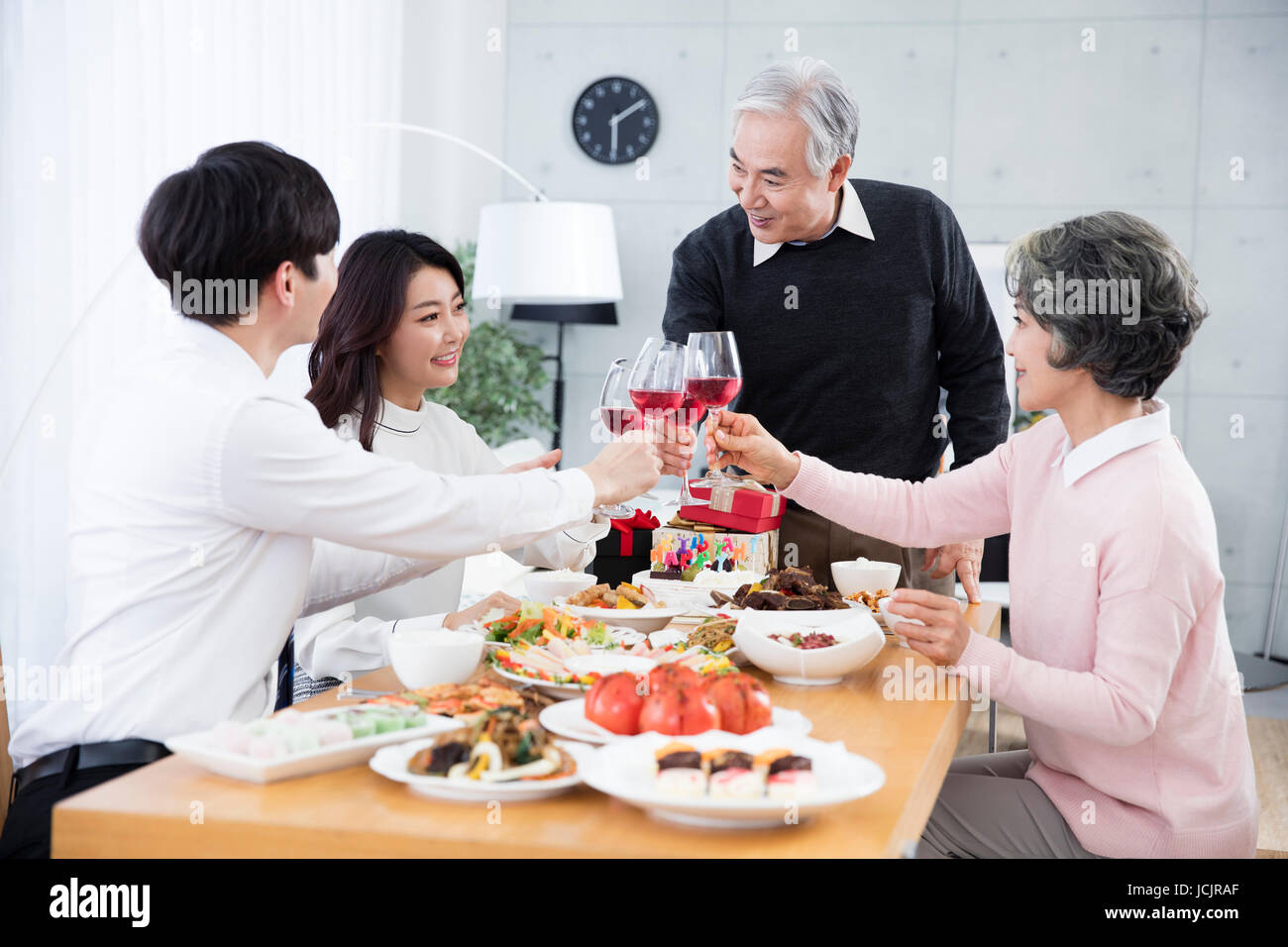 Harmonious family celebrating ceremony Stock Photo - Alamy