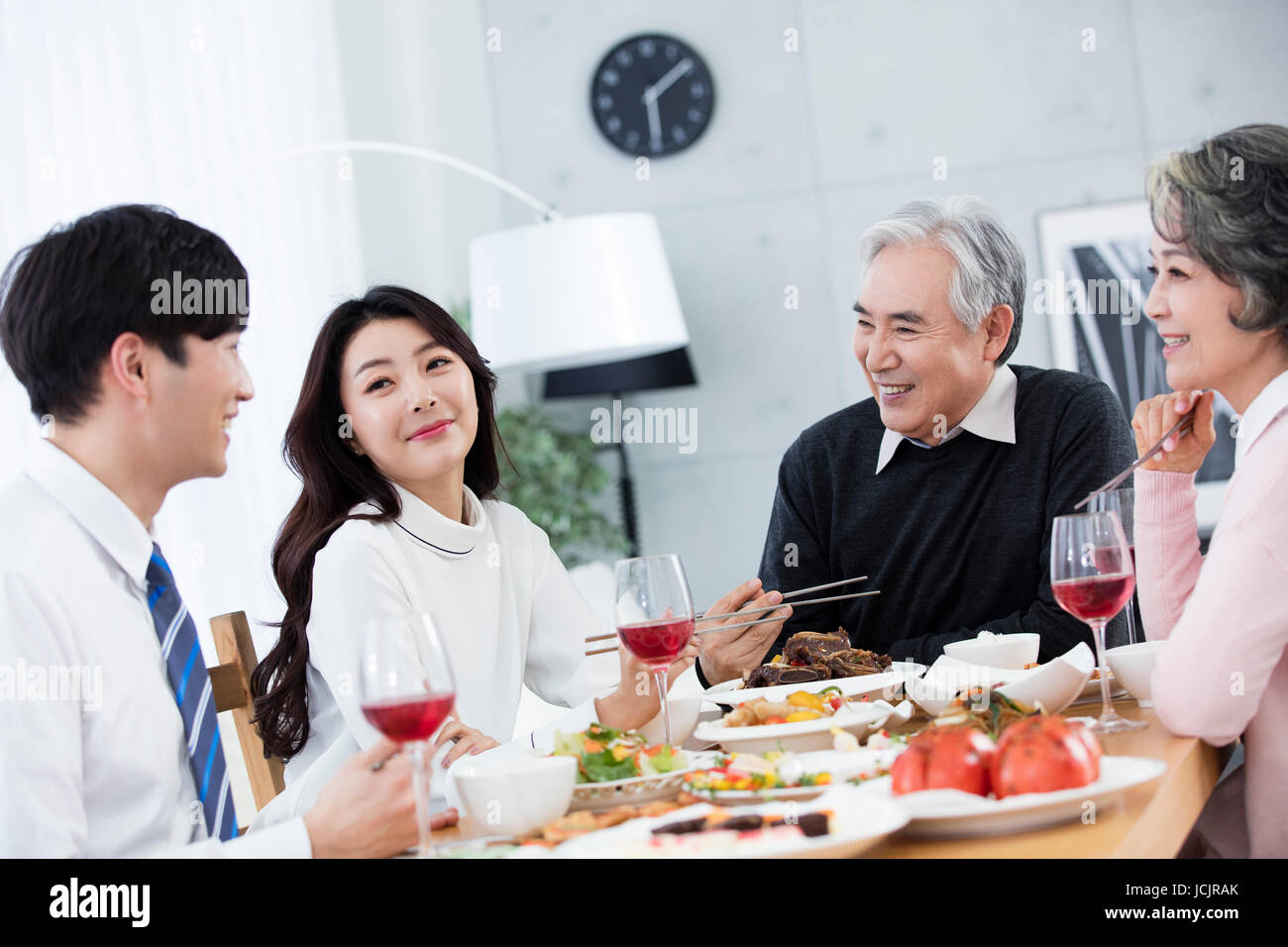 Harmonious family having meals hi-res stock photography and images - Alamy