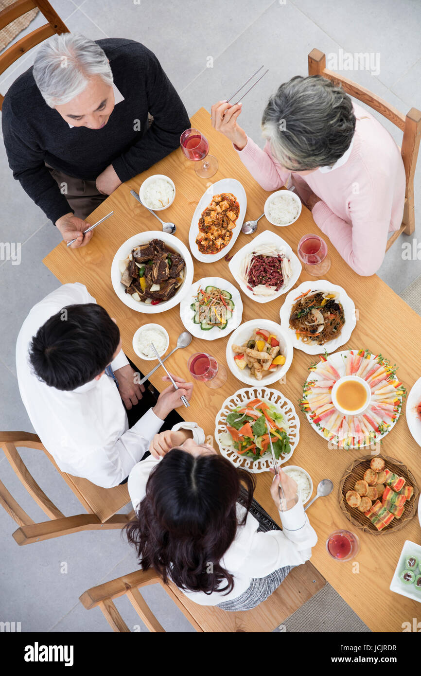 High angle view of harmonious family having meals Stock Photo - Alamy