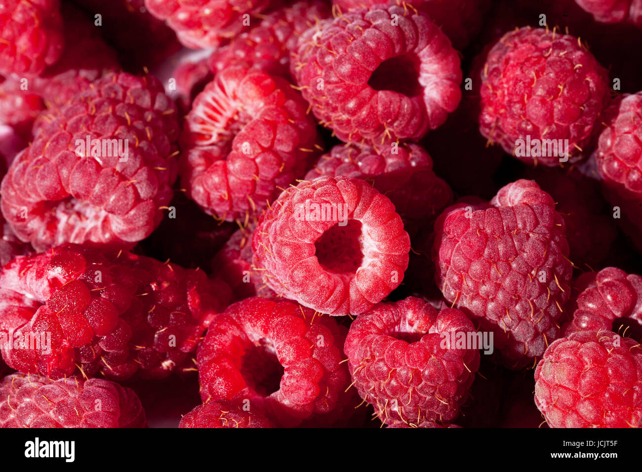 group of red rasberries close up Stock Photo - Alamy