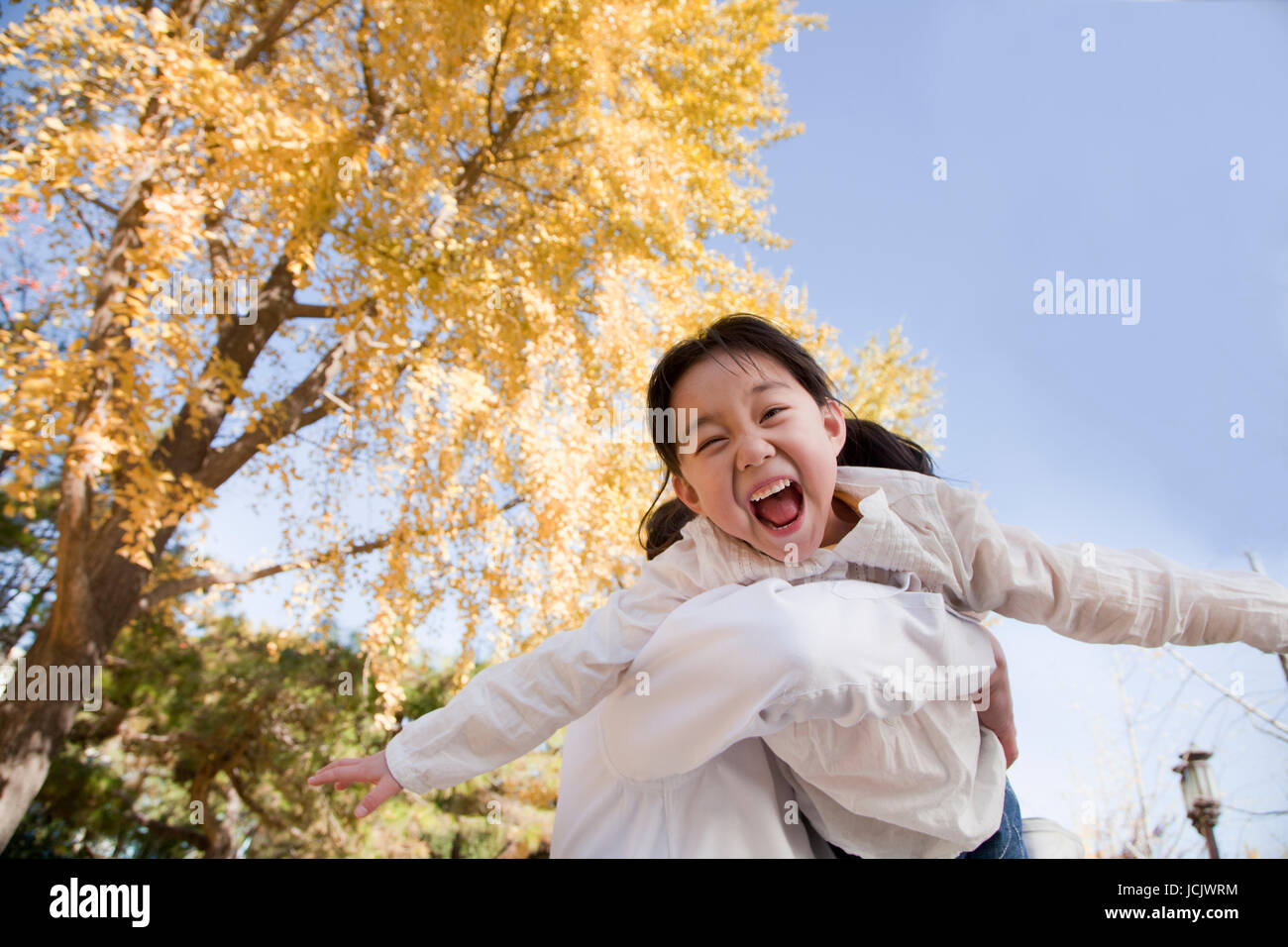 Chinese grandfather carrying granddaughter hi-res stock photography and ...