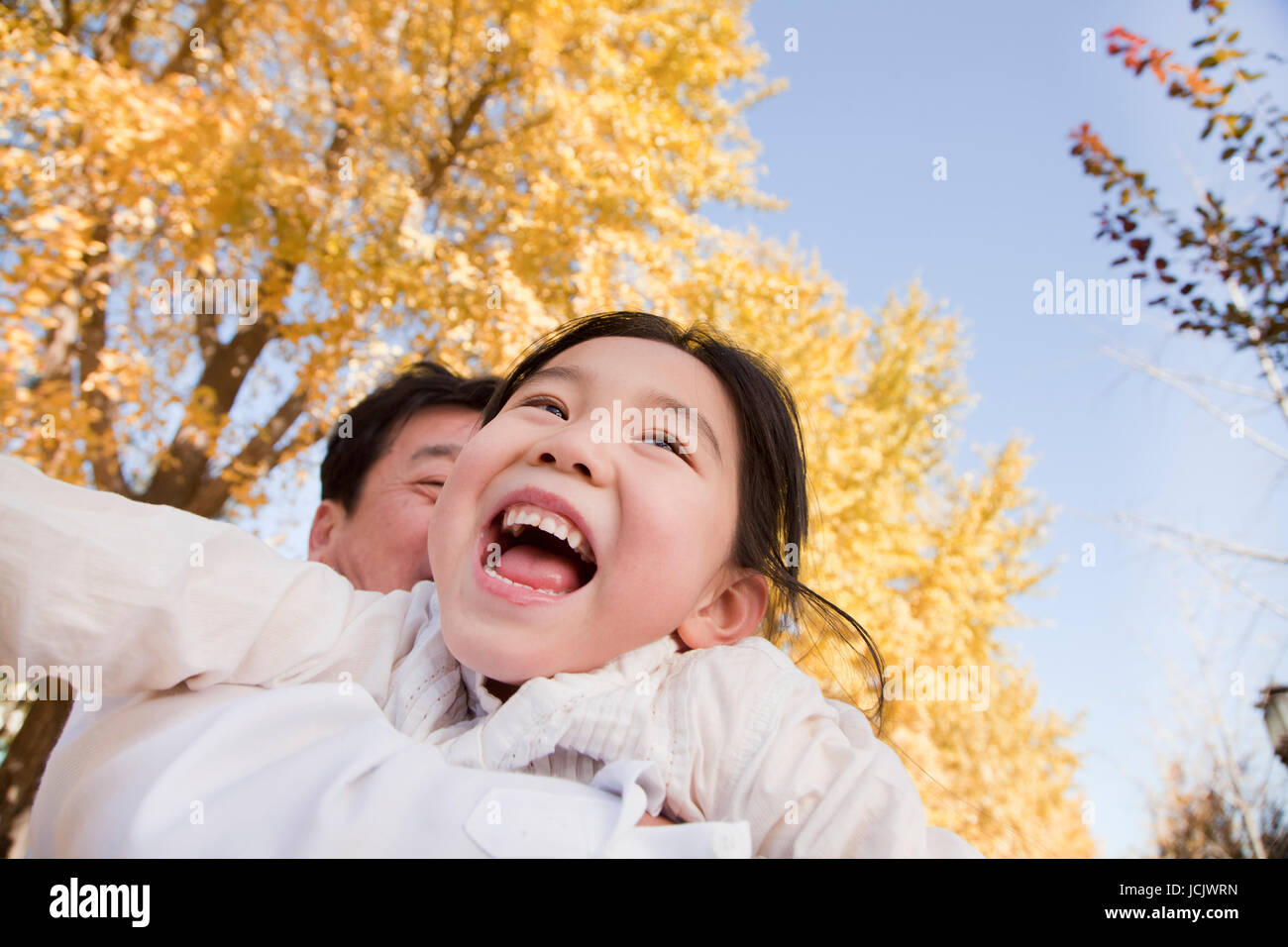 Chinese grandfather carrying granddaughter hi-res stock photography and ...