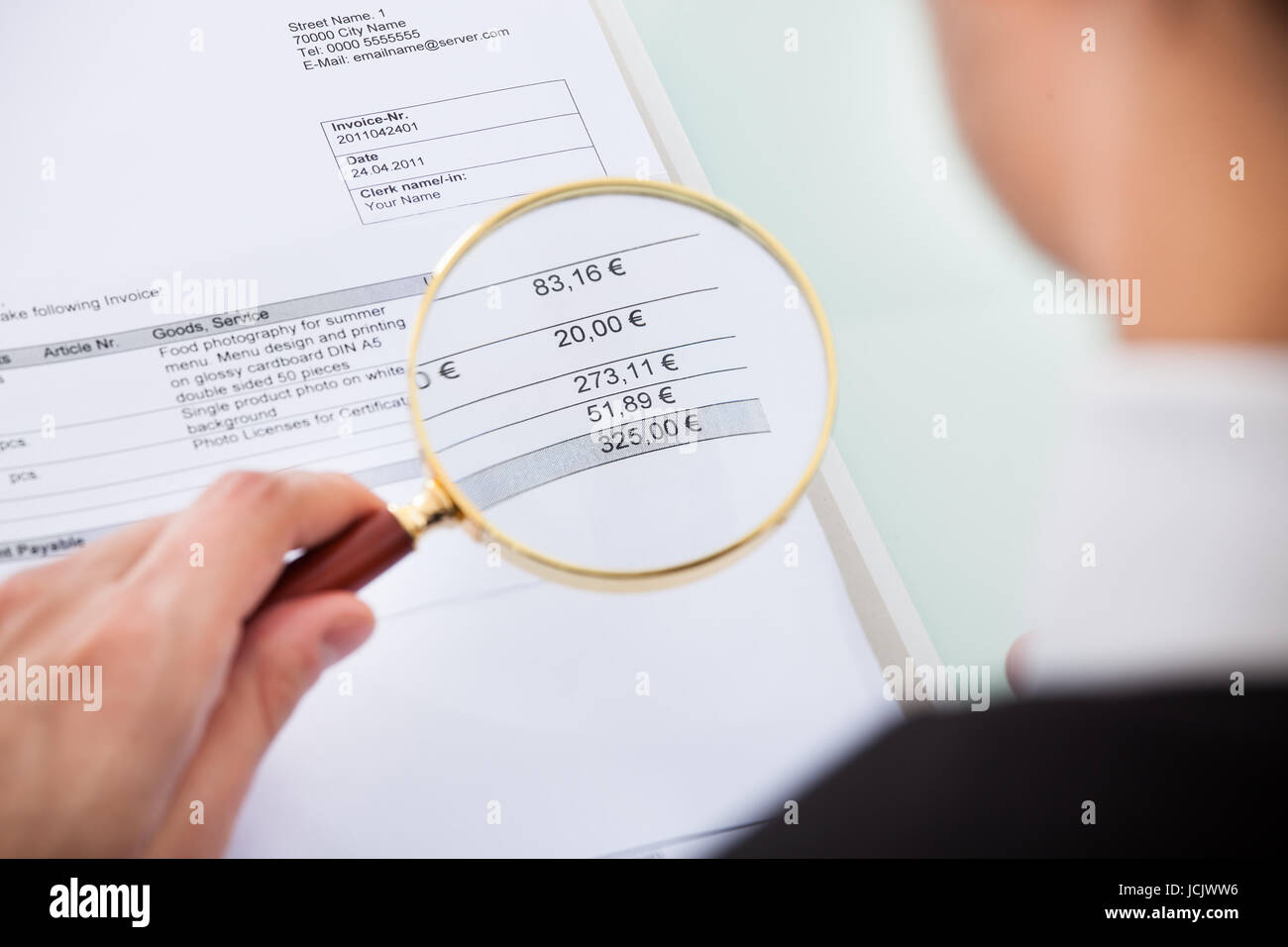 Businessman Looking At Document Through Magnifying Glass Stock Photo ...