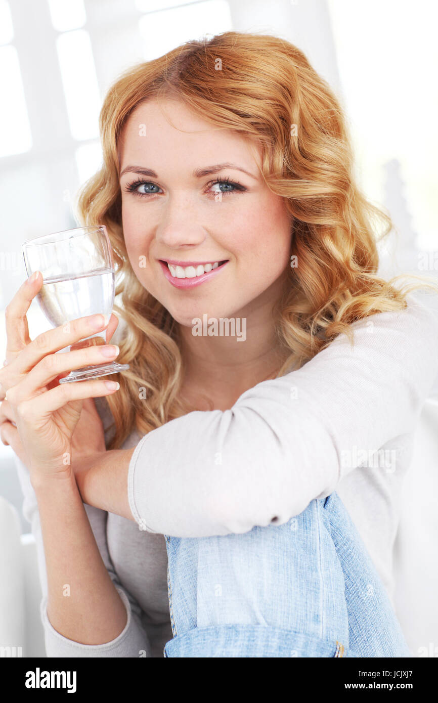 Portrait of woman drinking water Stock Photo - Alamy