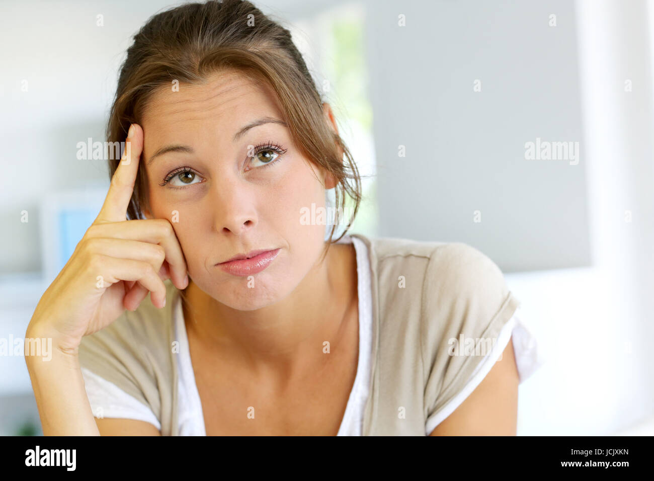 Closeup of woman with thoughtful look Stock Photo - Alamy