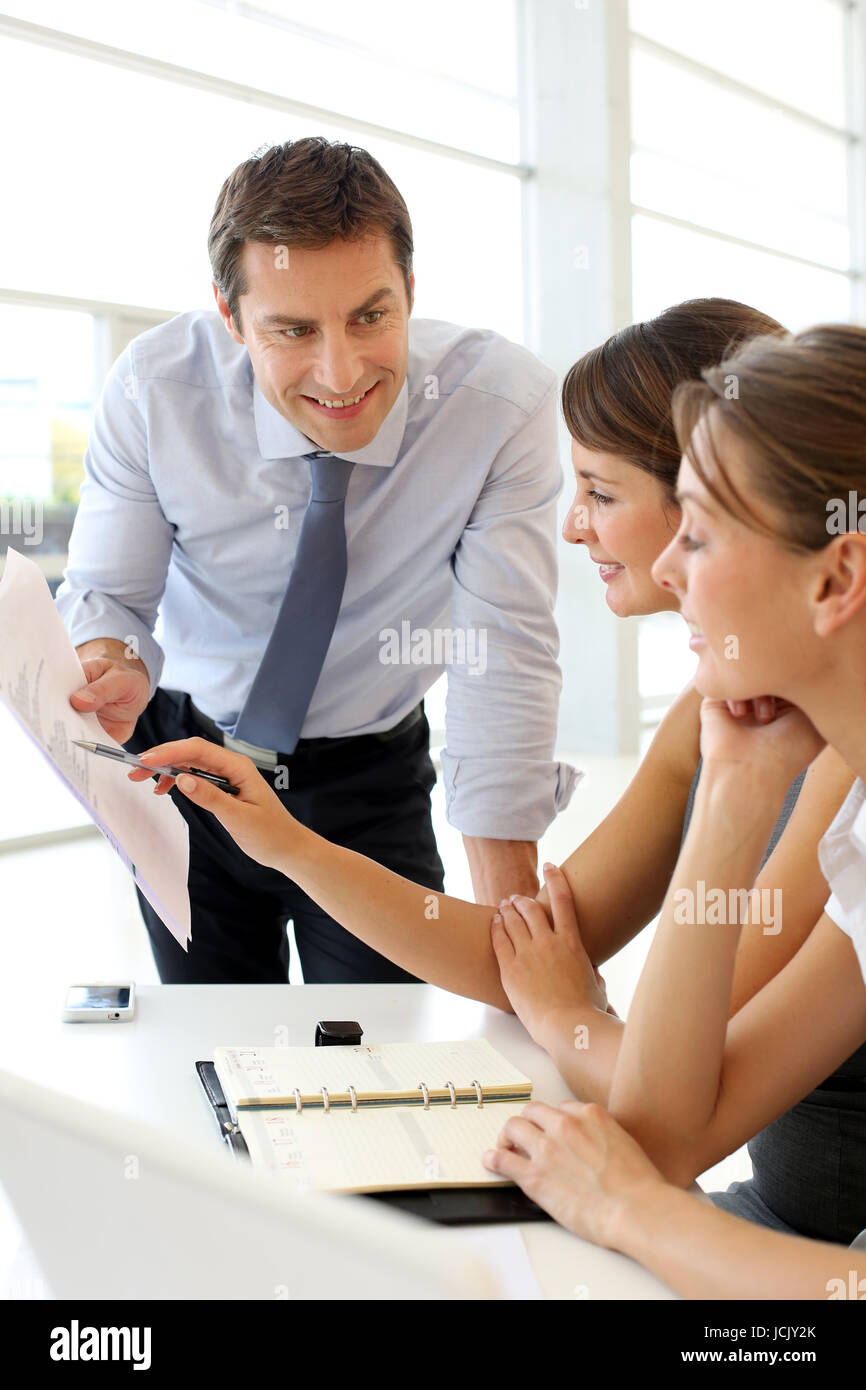 Manager presenting business plan to employees Stock Photo - Alamy