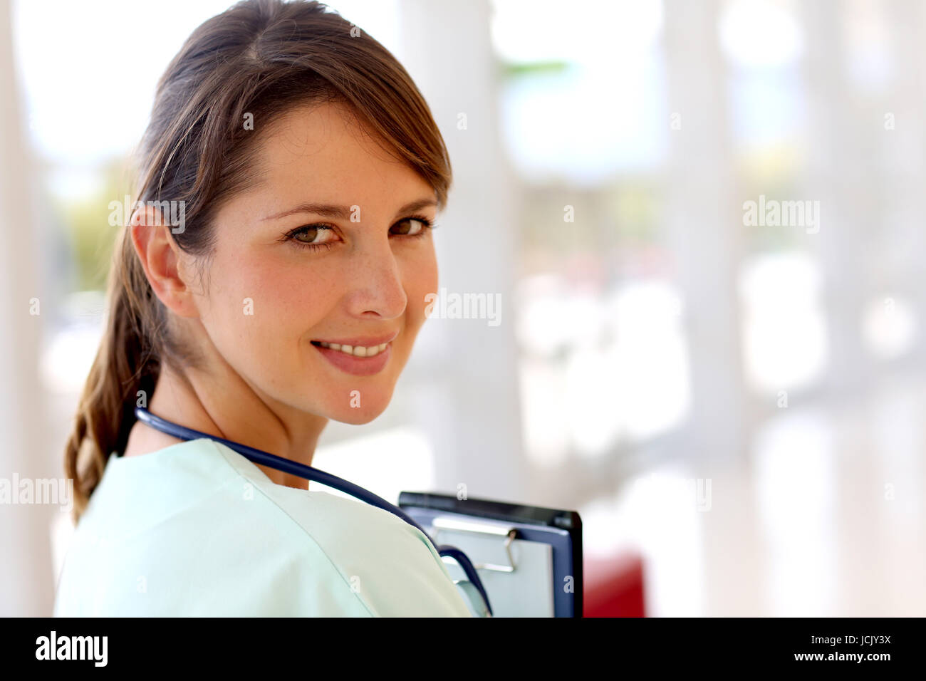Portrait of smiling and caring nurse Stock Photo - Alamy