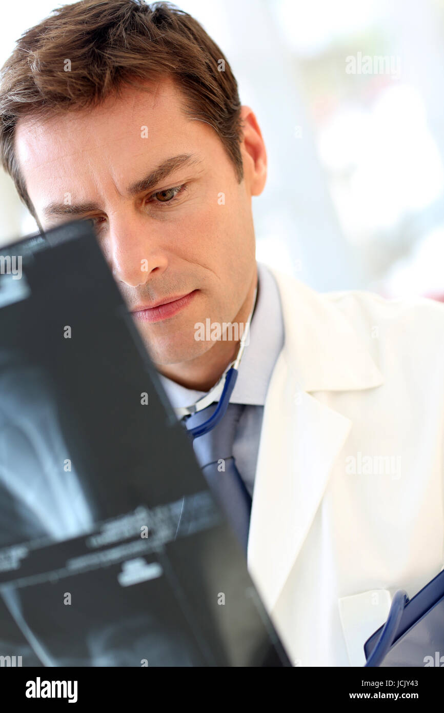 Doctor checking on patient Xray results Stock Photo - Alamy