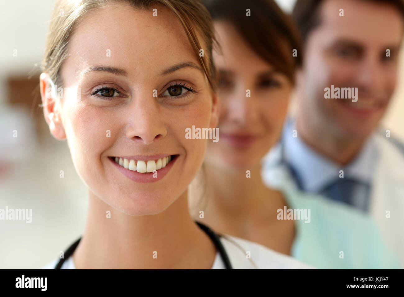 Smiling medical team in uniform Stock Photo - Alamy
