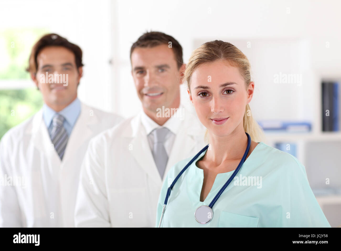 Medical team standing in clinic room Stock Photo - Alamy