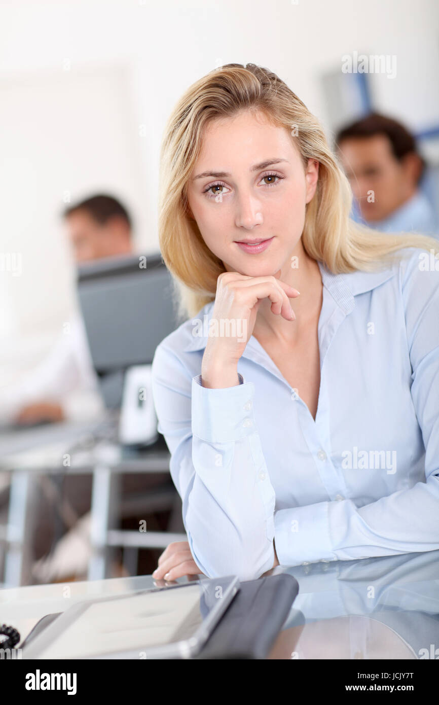 Portrait of smiling office worker Stock Photo - Alamy