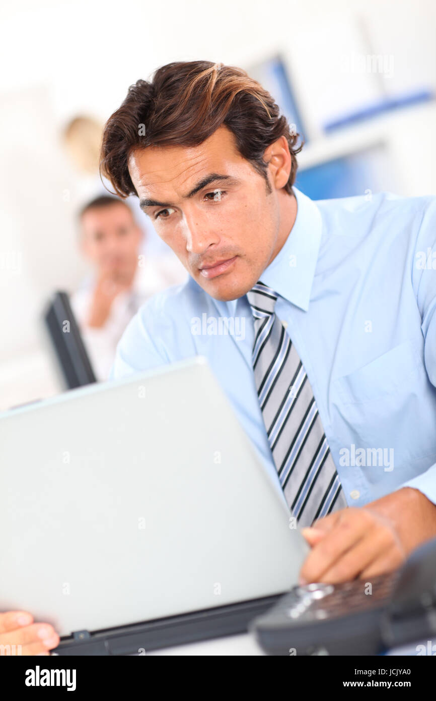 Businessman with perplexed expression Stock Photo - Alamy