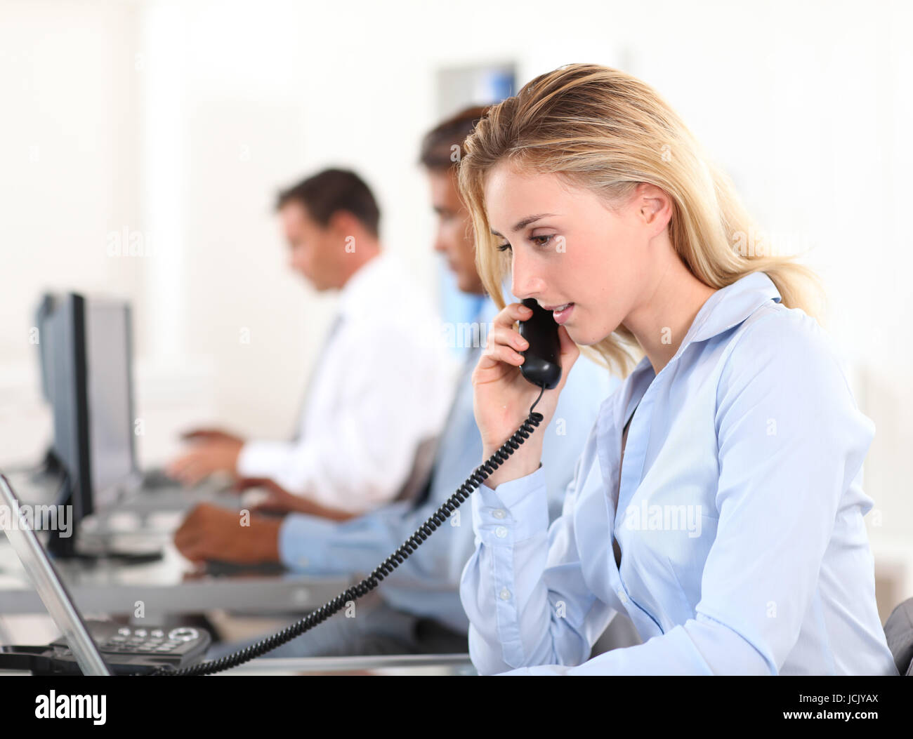 Office worker answering the phone Stock Photo - Alamy