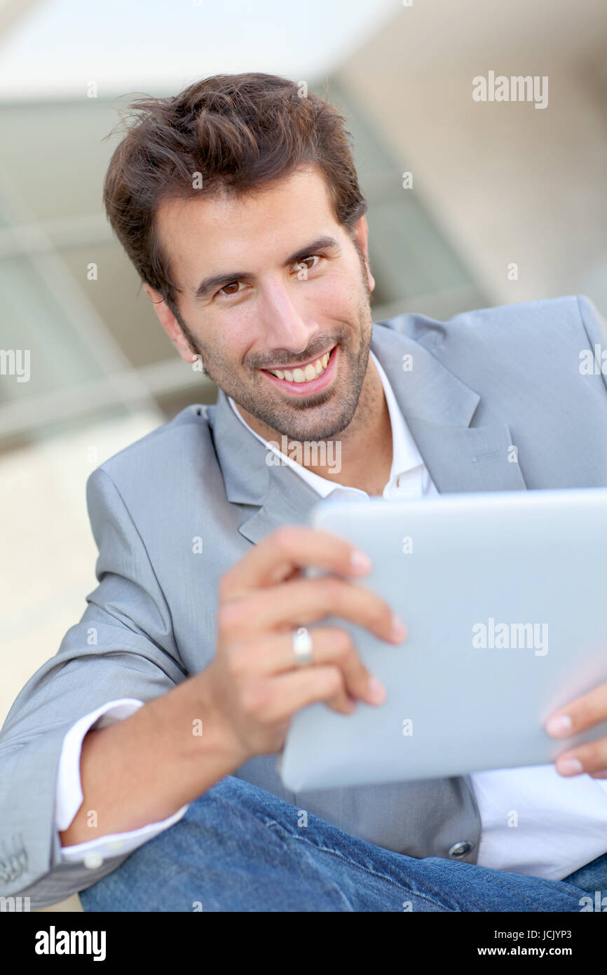 Man using electronic tablet station hi-res stock photography and images ...