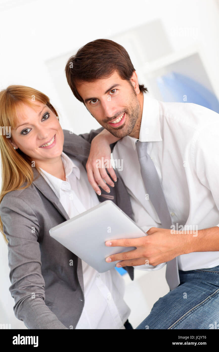 Business people in office using electronic tablet Stock Photo - Alamy