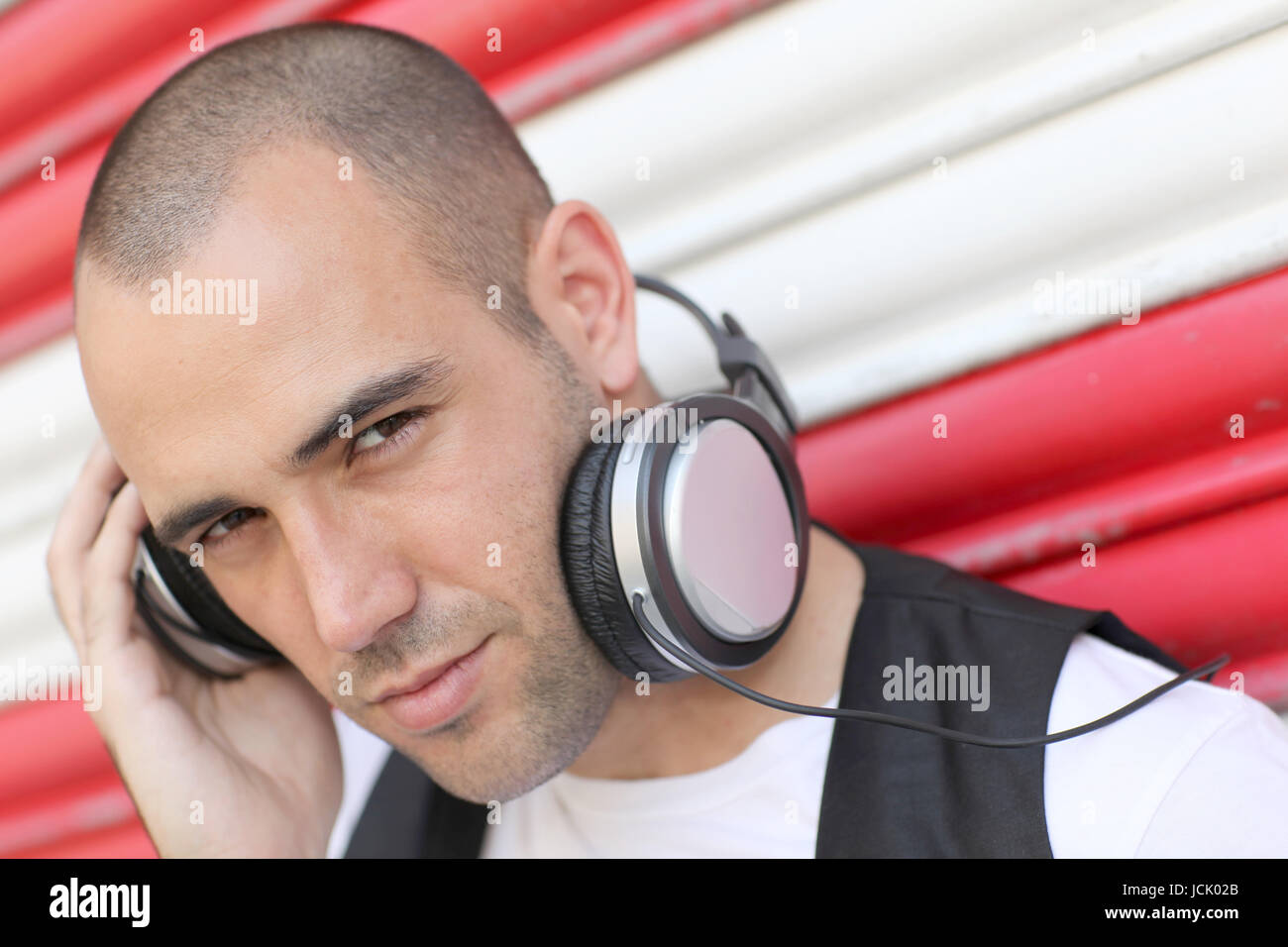 Young man with music headphones Stock Photo - Alamy