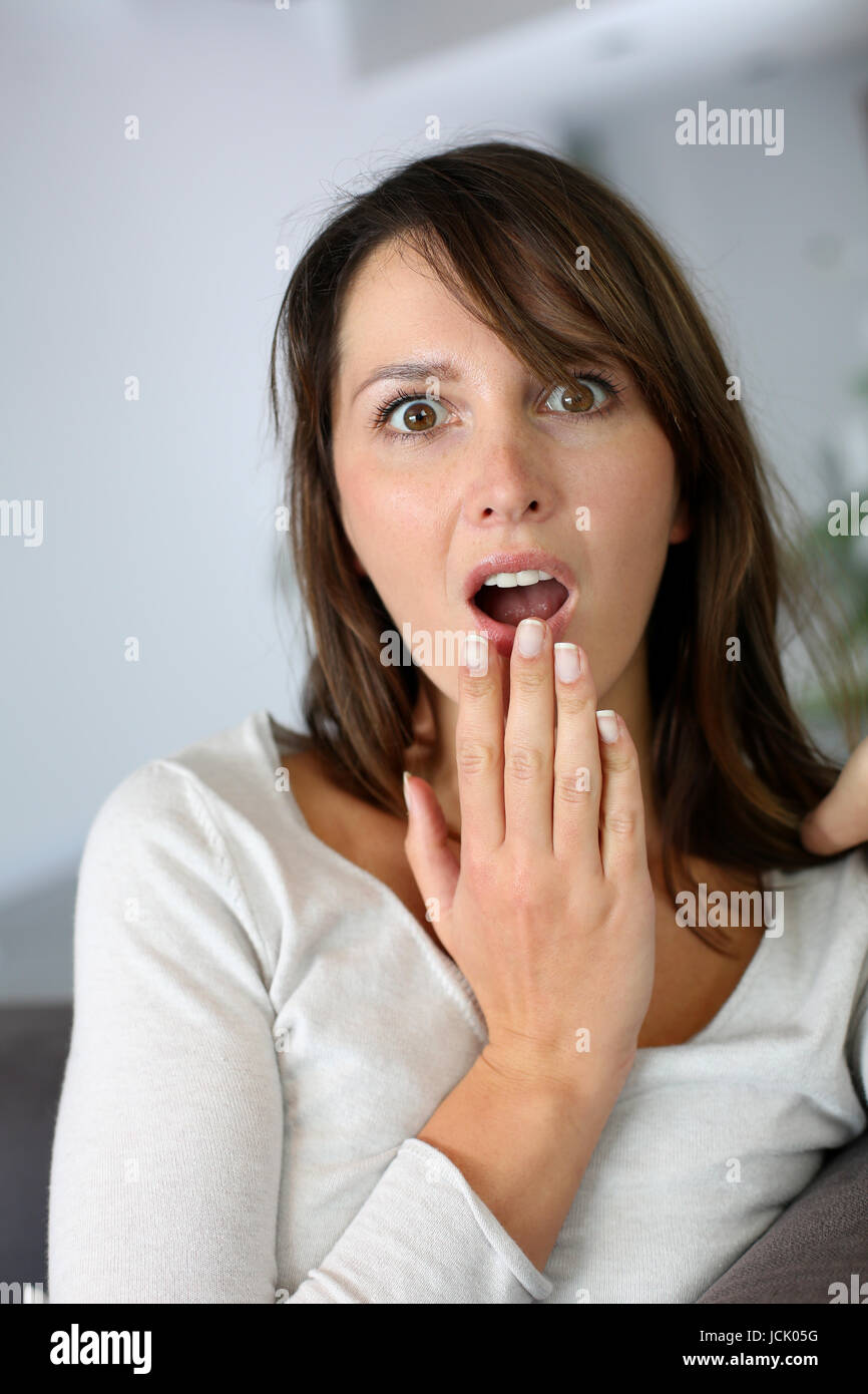 Woman with surprised expression on her face Stock Photo - Alamy