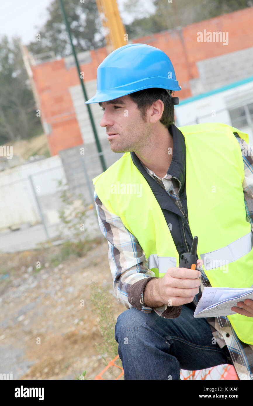 Construction manager using electronic tablet on site Stock Photo - Alamy