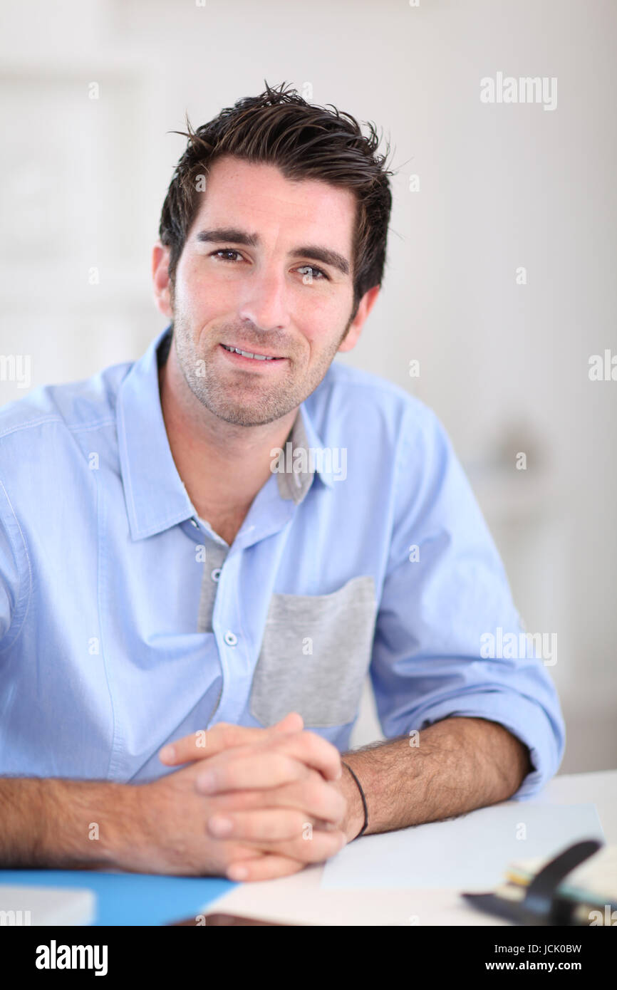 Portrait of smiling office worker Stock Photo - Alamy
